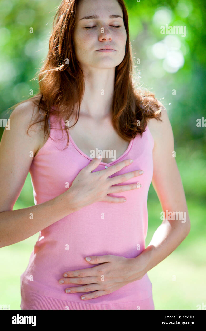 Woman breathing in nature Stock Photo - Alamy