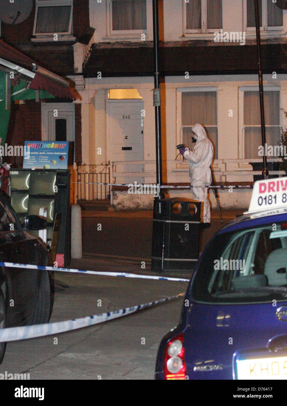 Police and Forensic investigators at a crime scene where a man was shot ...