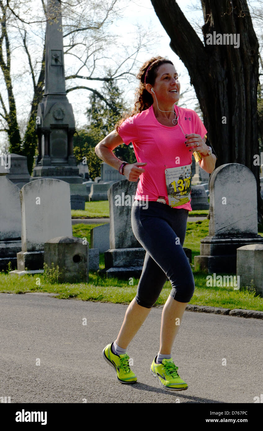 Half Marathon runner races in Rochester, NY Stock Photo - Alamy