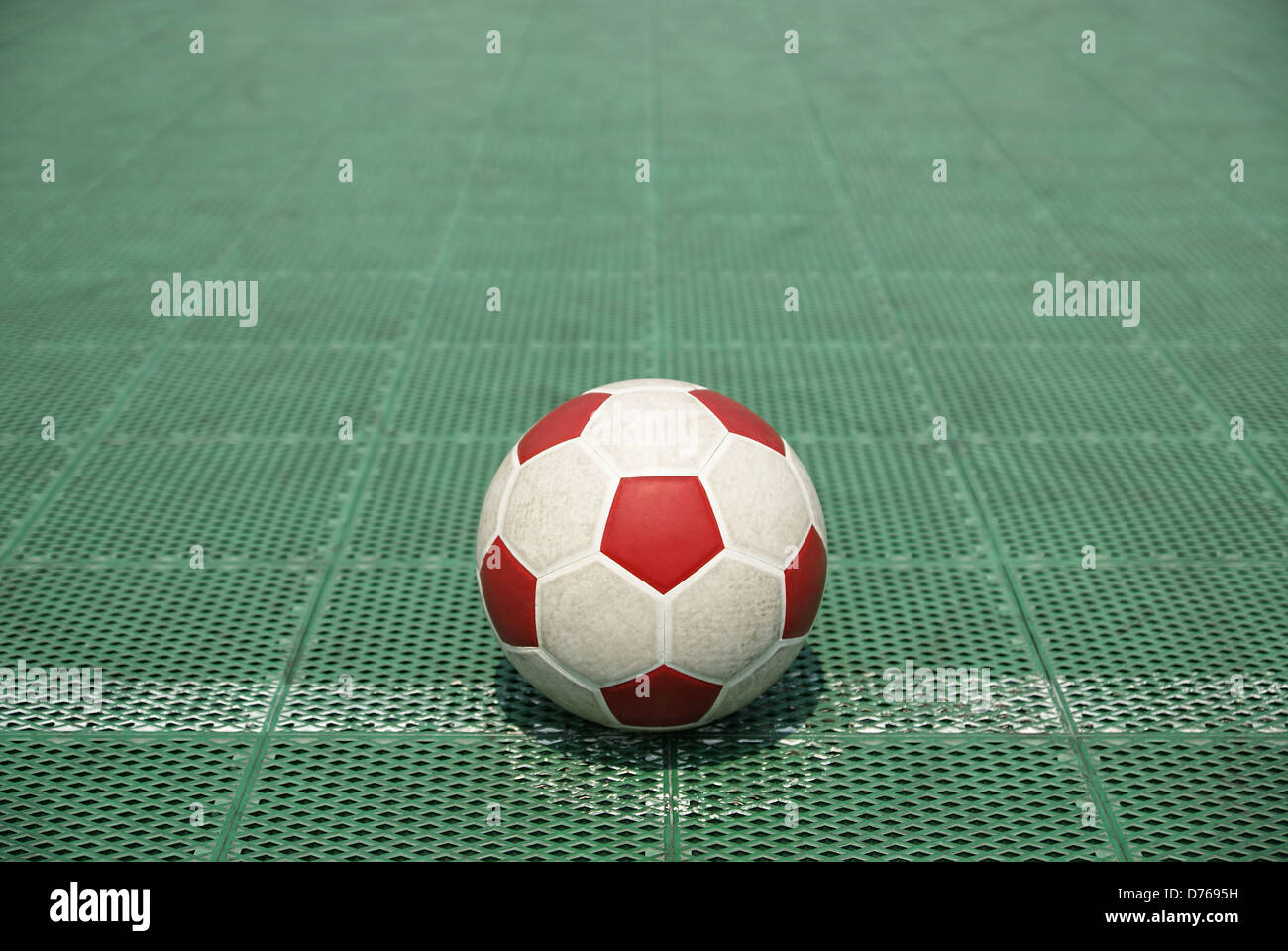 Grunge football in outdoor field Stock Photo - Alamy
