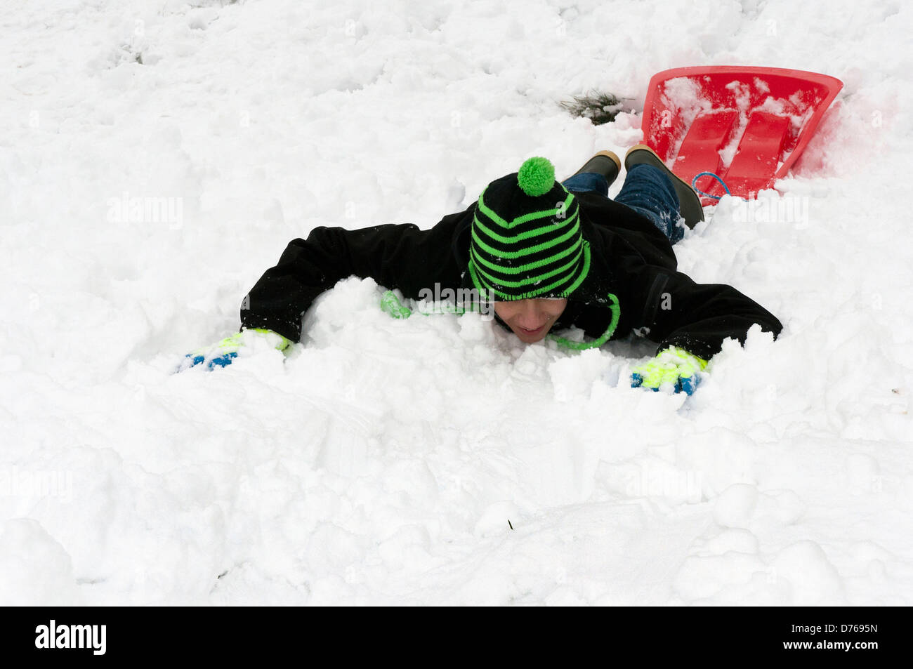 A young boy sledging in the snow The countries capital and surrounding ...