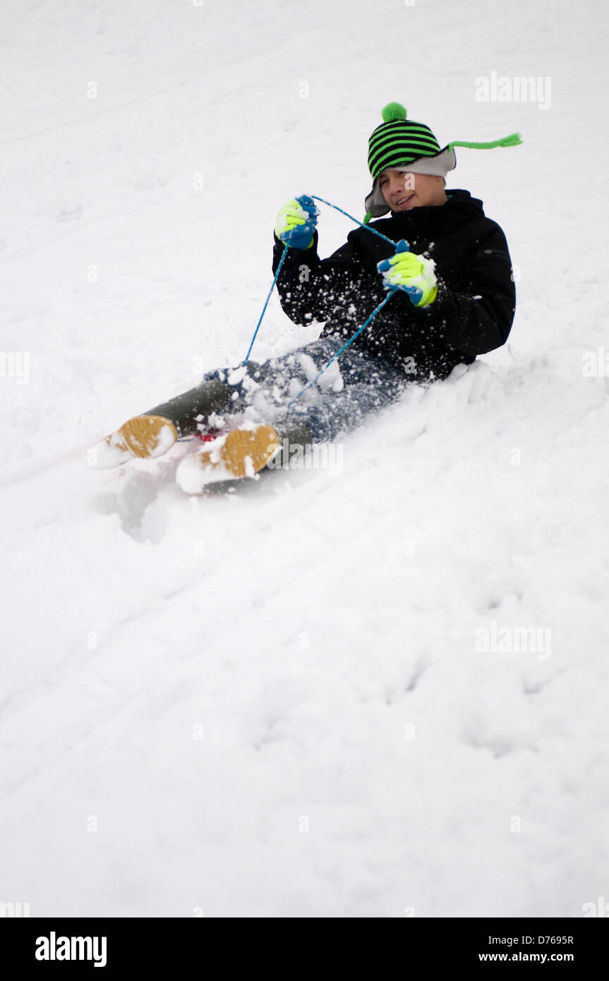 A young boy sledging in the snow The countries capital and surrounding ...