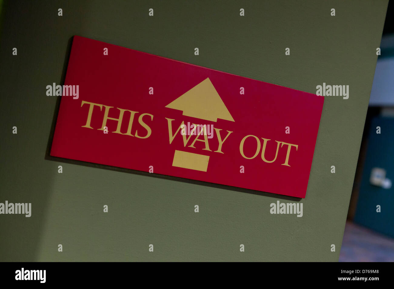 "This Way Out" exit sign Stock Photo - Alamy