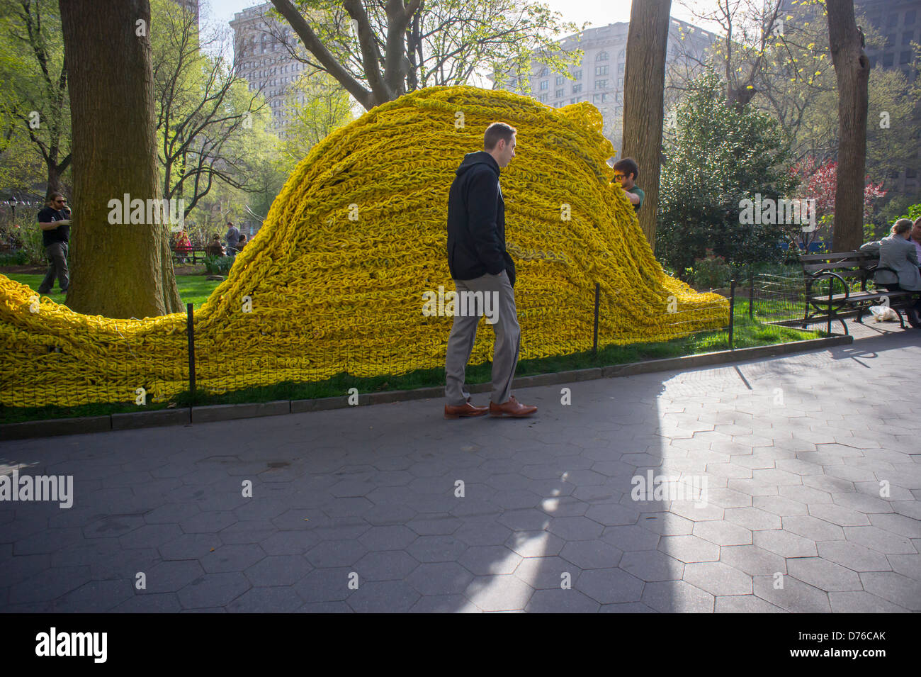 Workers install sections of "Red, Yellow and Blue" by the artist Orly ...