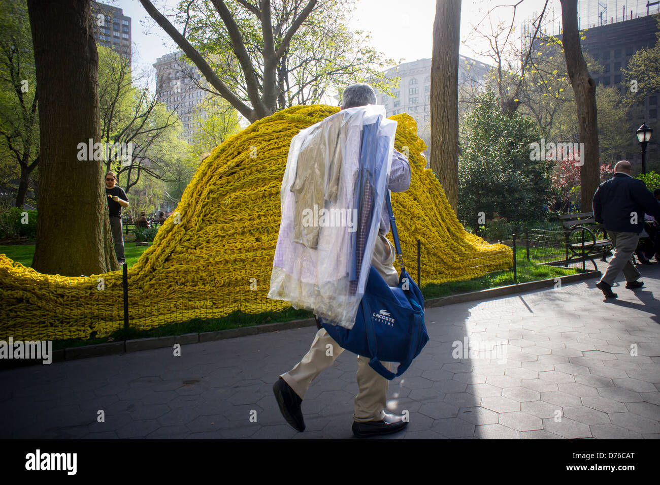 Workers install sections of "Red, Yellow and Blue" by the artist Orly ...