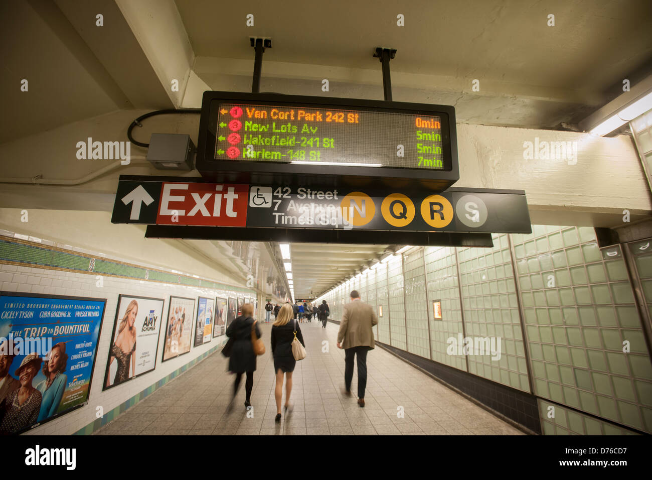 Travelers in the Times Square station in the New York subway line Stock ...
