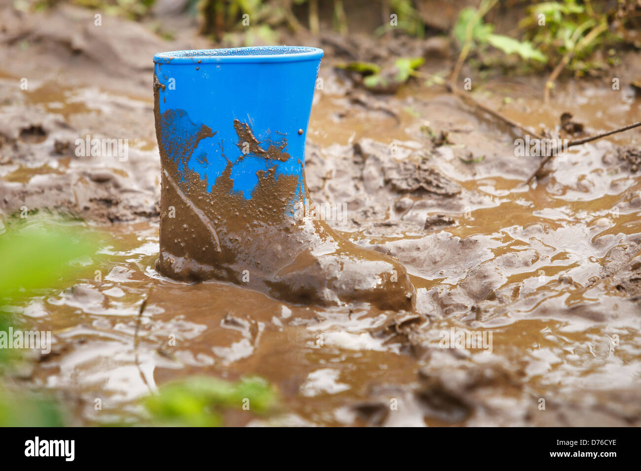 Children gumboot stuck in mud Stock Photo - Alamy