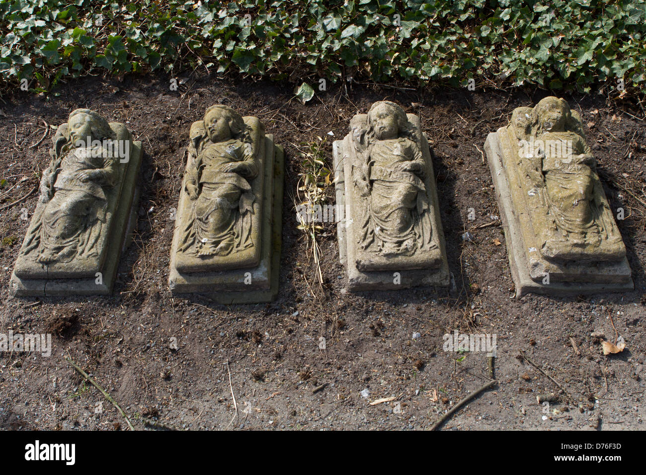 Angelic stone carvings mark children's graves Stock Photo - Alamy