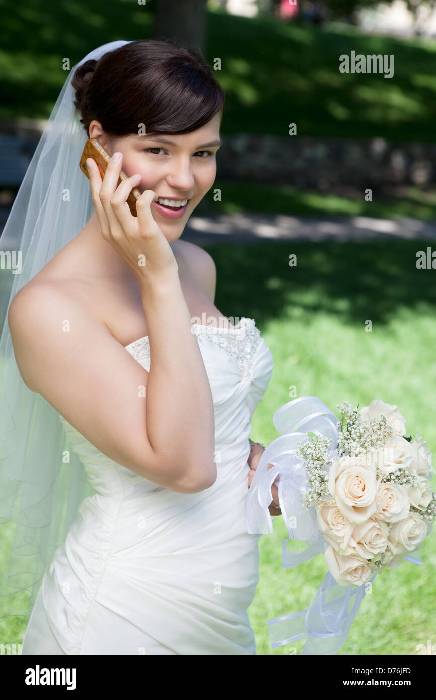 Happy Bride Using Cell Phone Stock Photo - Alamy