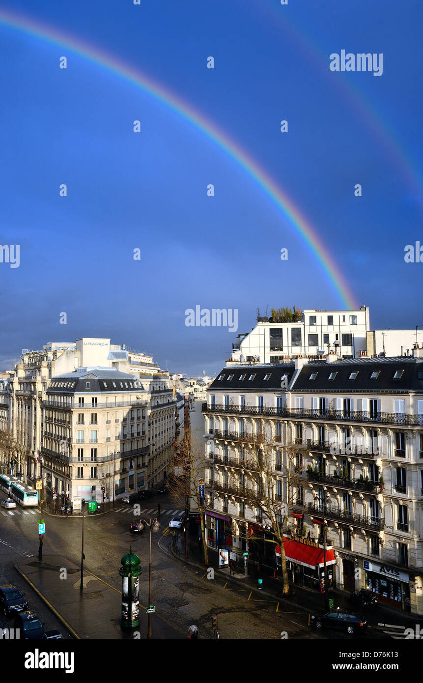 Paris skyline with rainbow against dark blue sky Stock Photo - Alamy