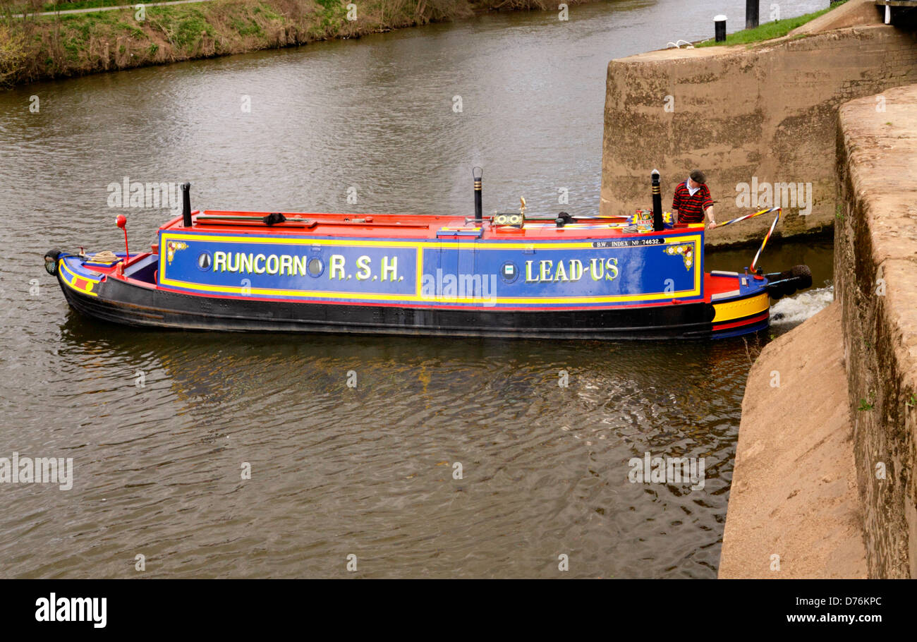 Canal barge leaving locks in Worcester and Birmingham canal to enter ...