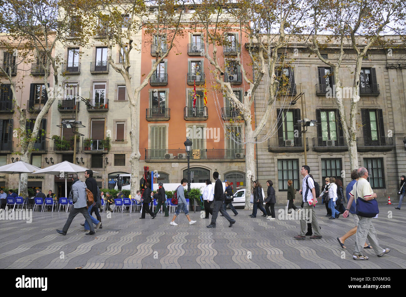 Barcelona, Spain - November 13, 2009 : people walk on wide pedestrian ...