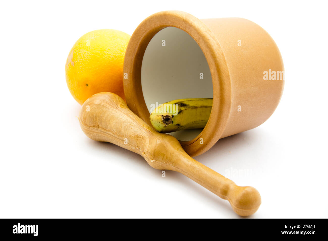Brown mortar with banana and orange Stock Photo - Alamy