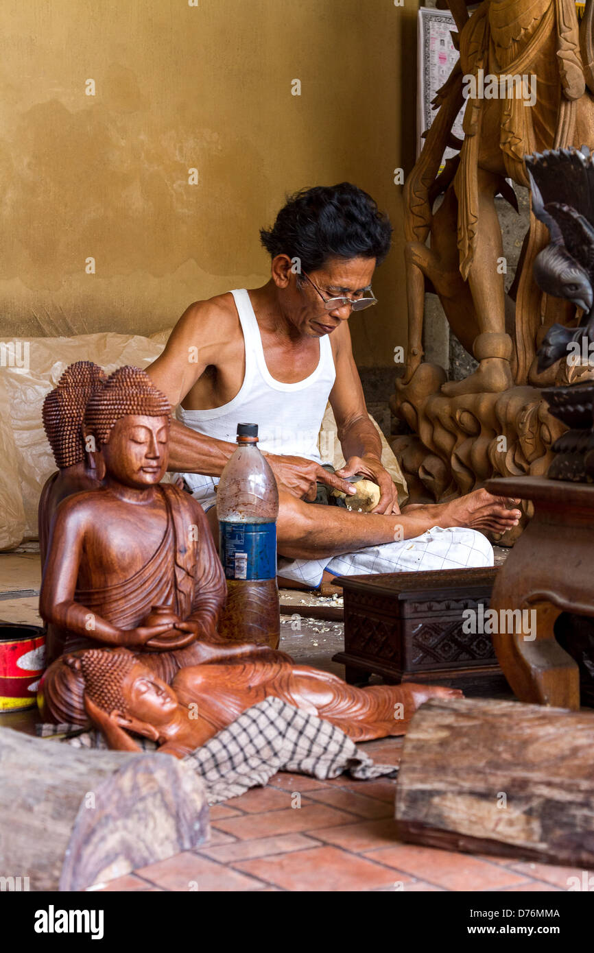 A man is making wooden crafts in Indonesia Stock Photo - Alamy