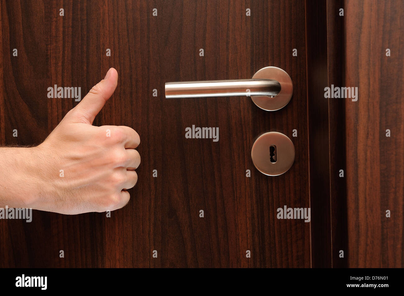 hand with thumb up to door Stock Photo - Alamy