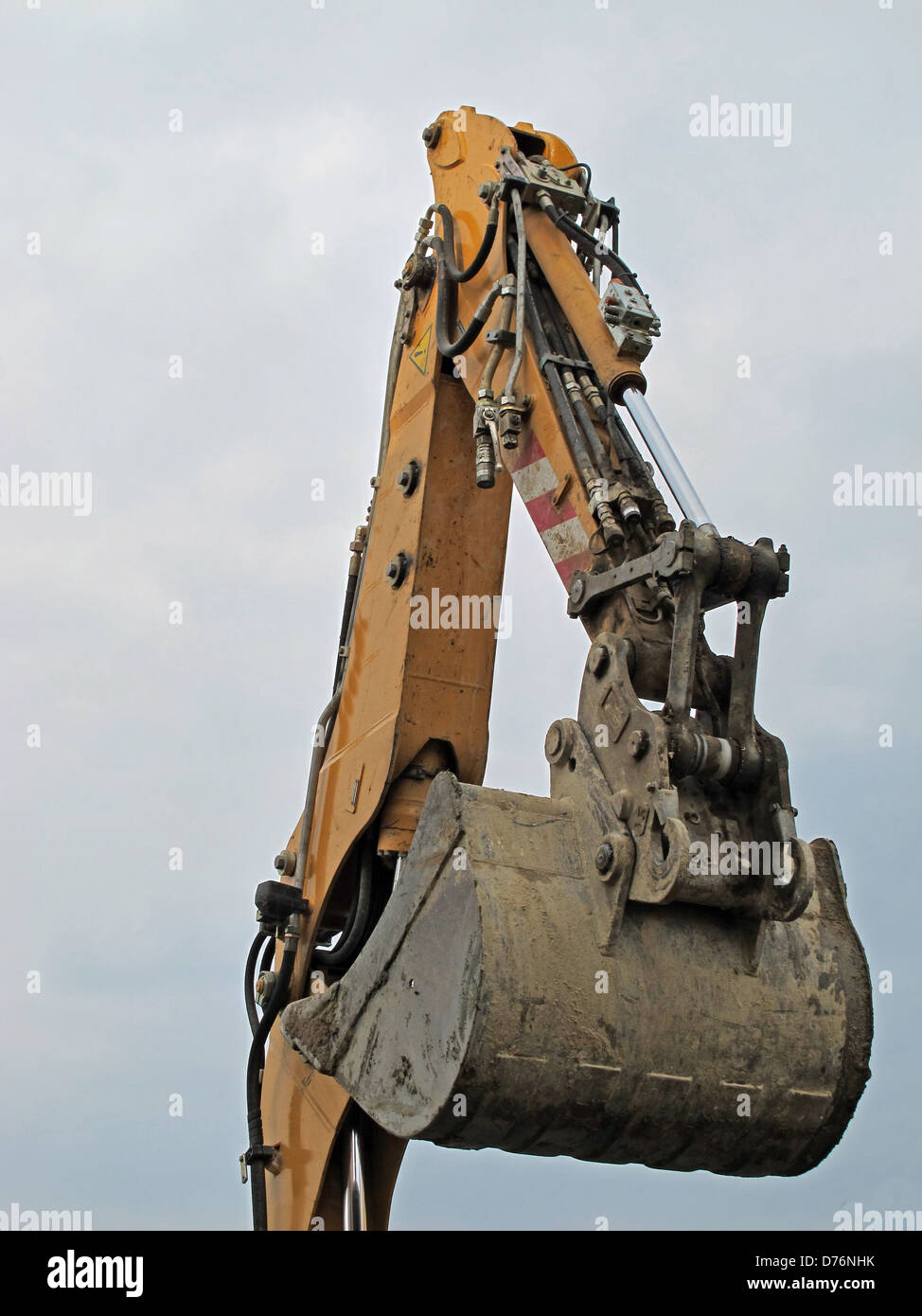 metal scraper bucket during the removal of pebbles in a construction ...