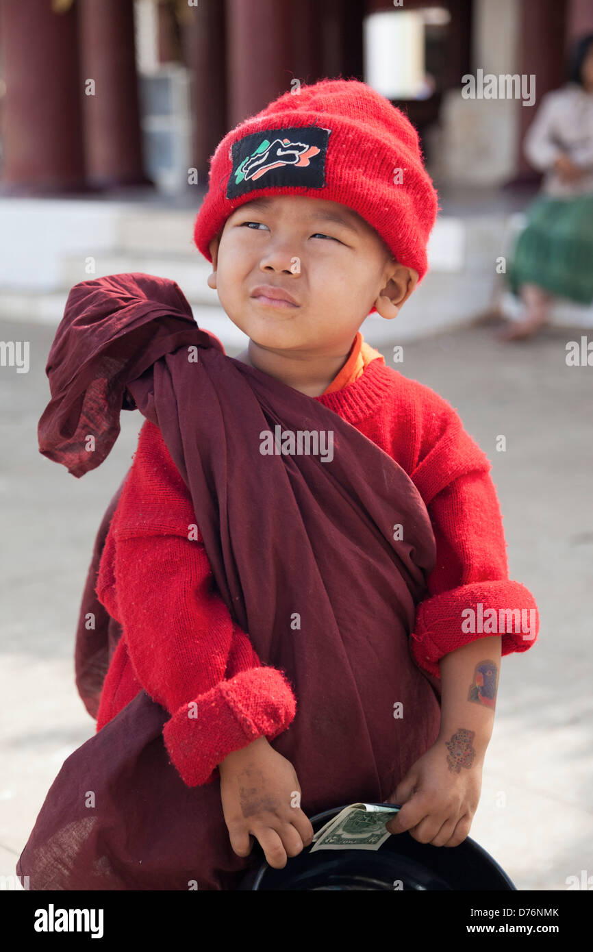 Tiny boy in Monk's robes and red hat with a his collection bowl 3 Stock ...