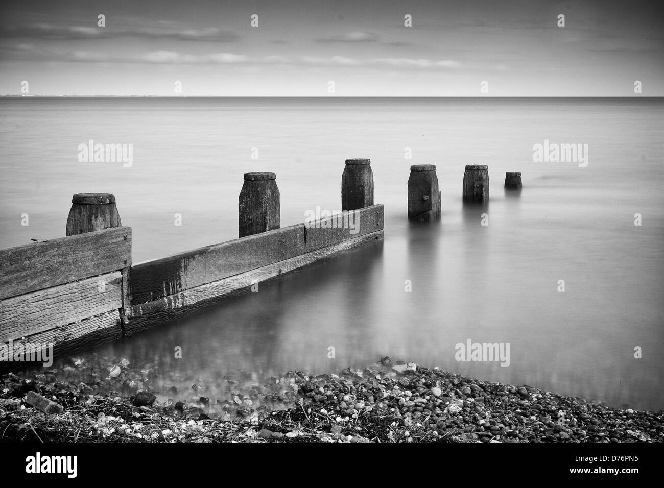 Groynes in black and white Stock Photo - Alamy