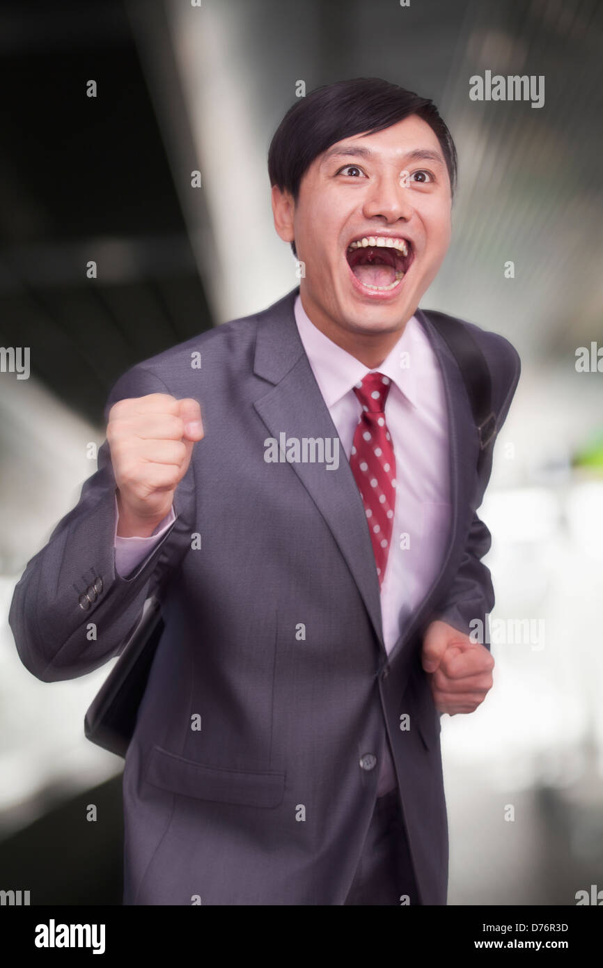 Young businessman running, Beijing Stock Photo - Alamy