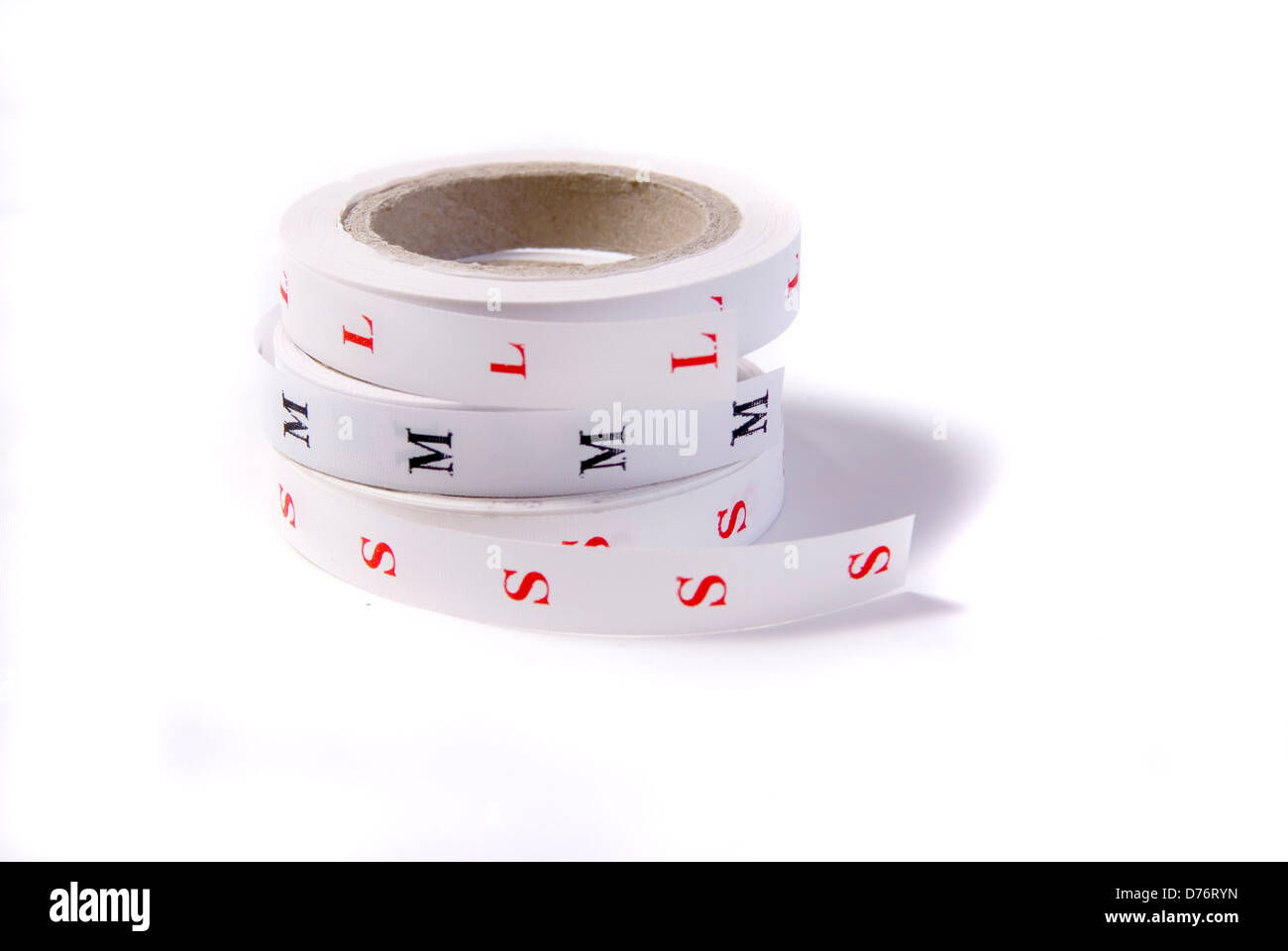 fabric size tags printed on white cotton ribbon Stock Photo - Alamy