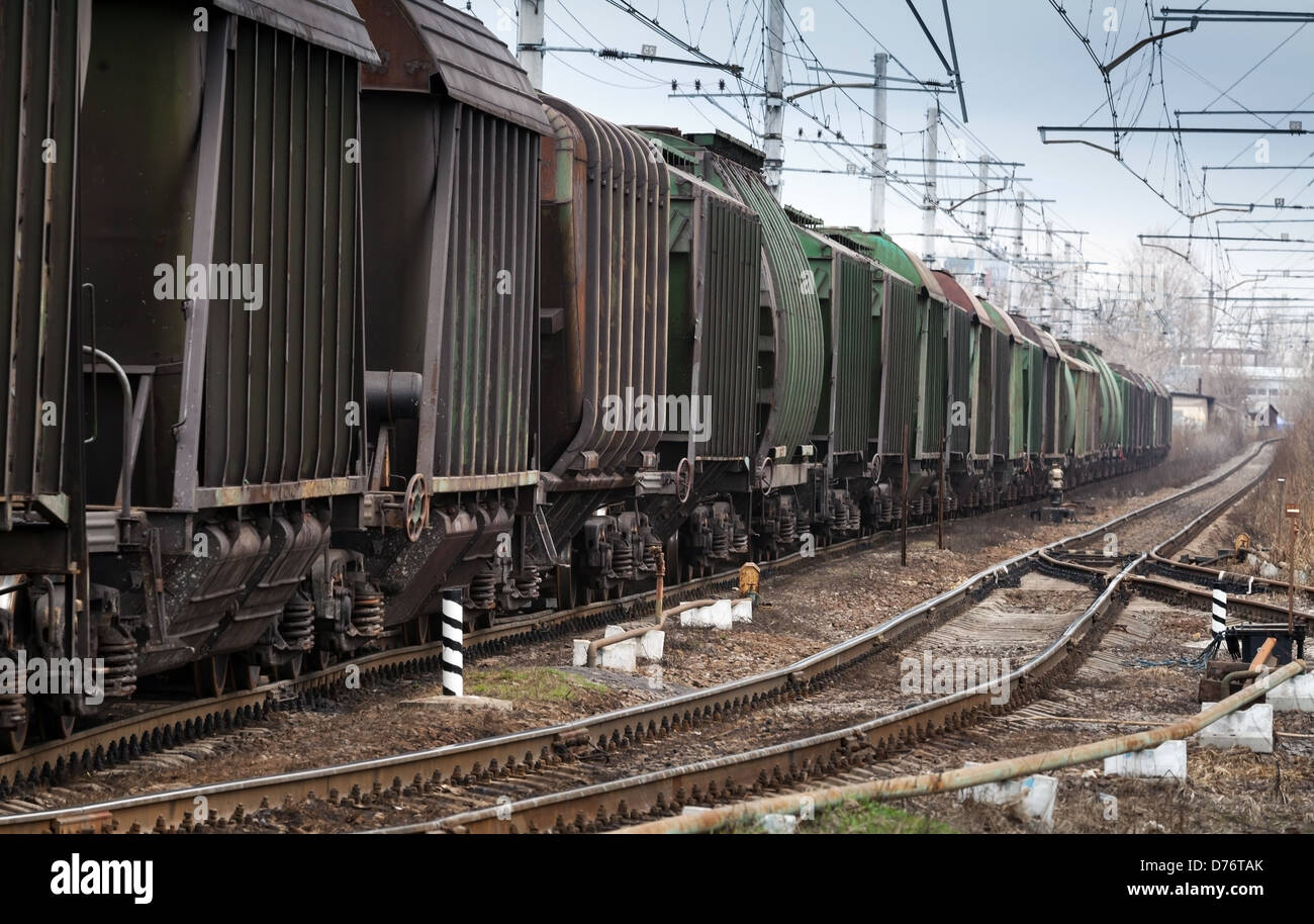 Railroad scene with cargo train Stock Photo - Alamy