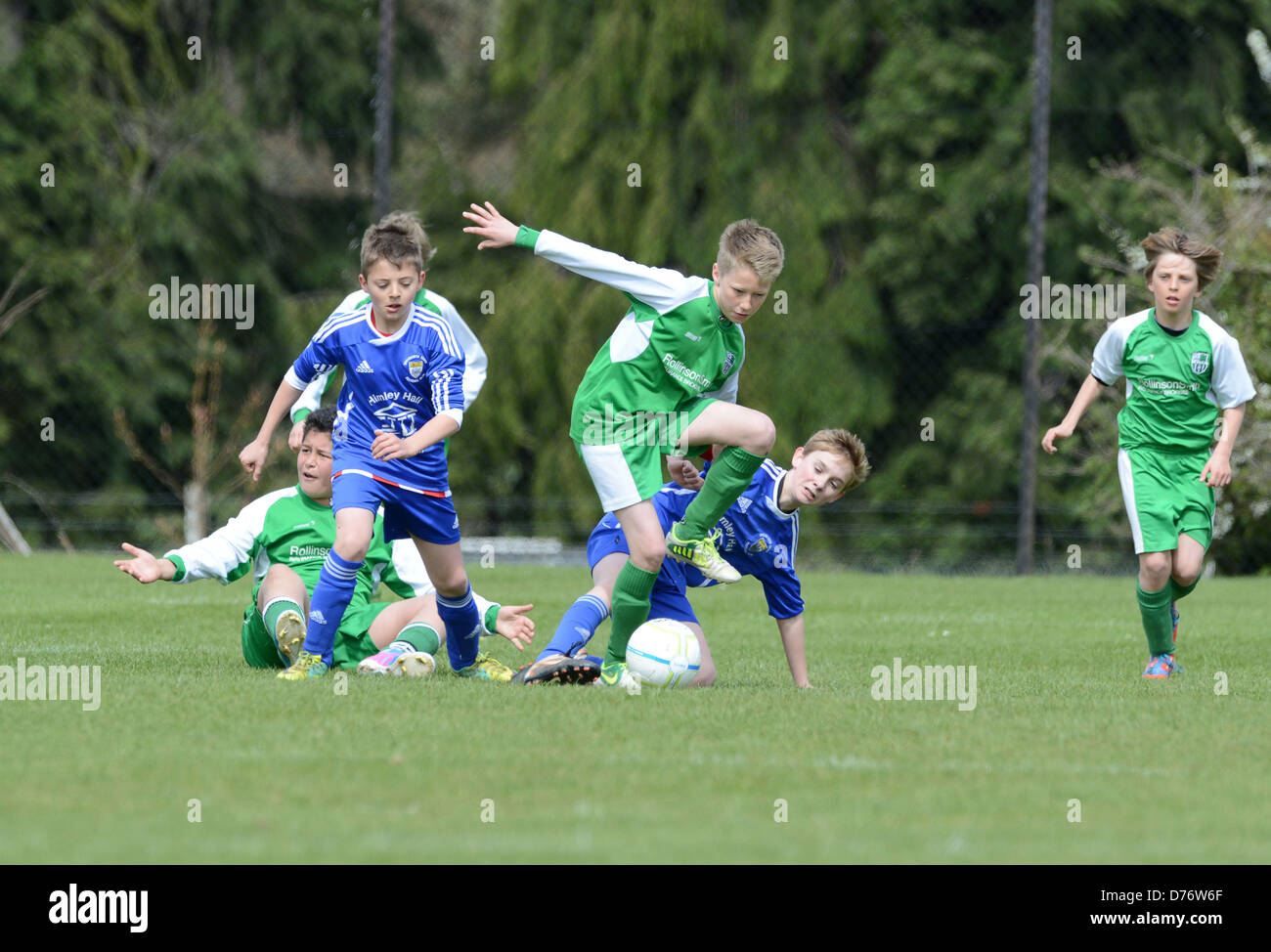 Junior boys football match action Uk Stock Photo - Alamy