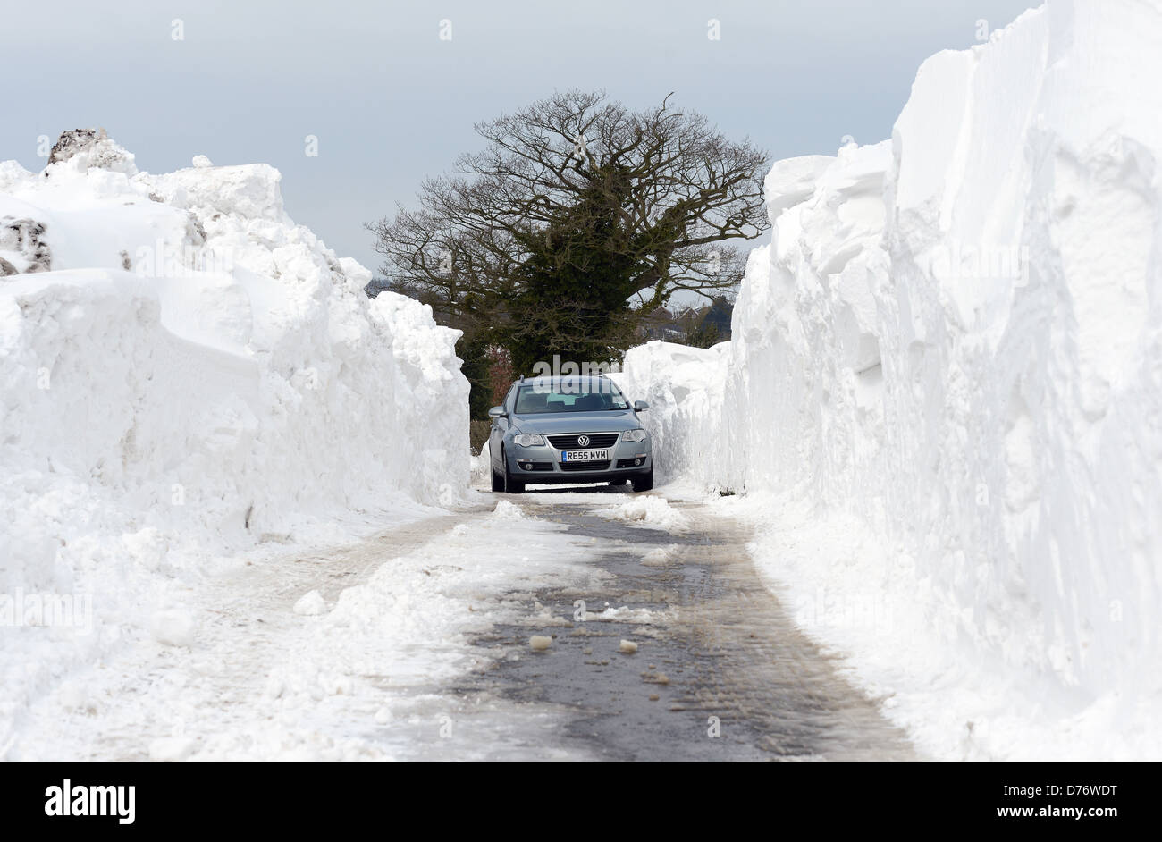 Snow and car in country lane in winter Shropshire England Uk Stock ...