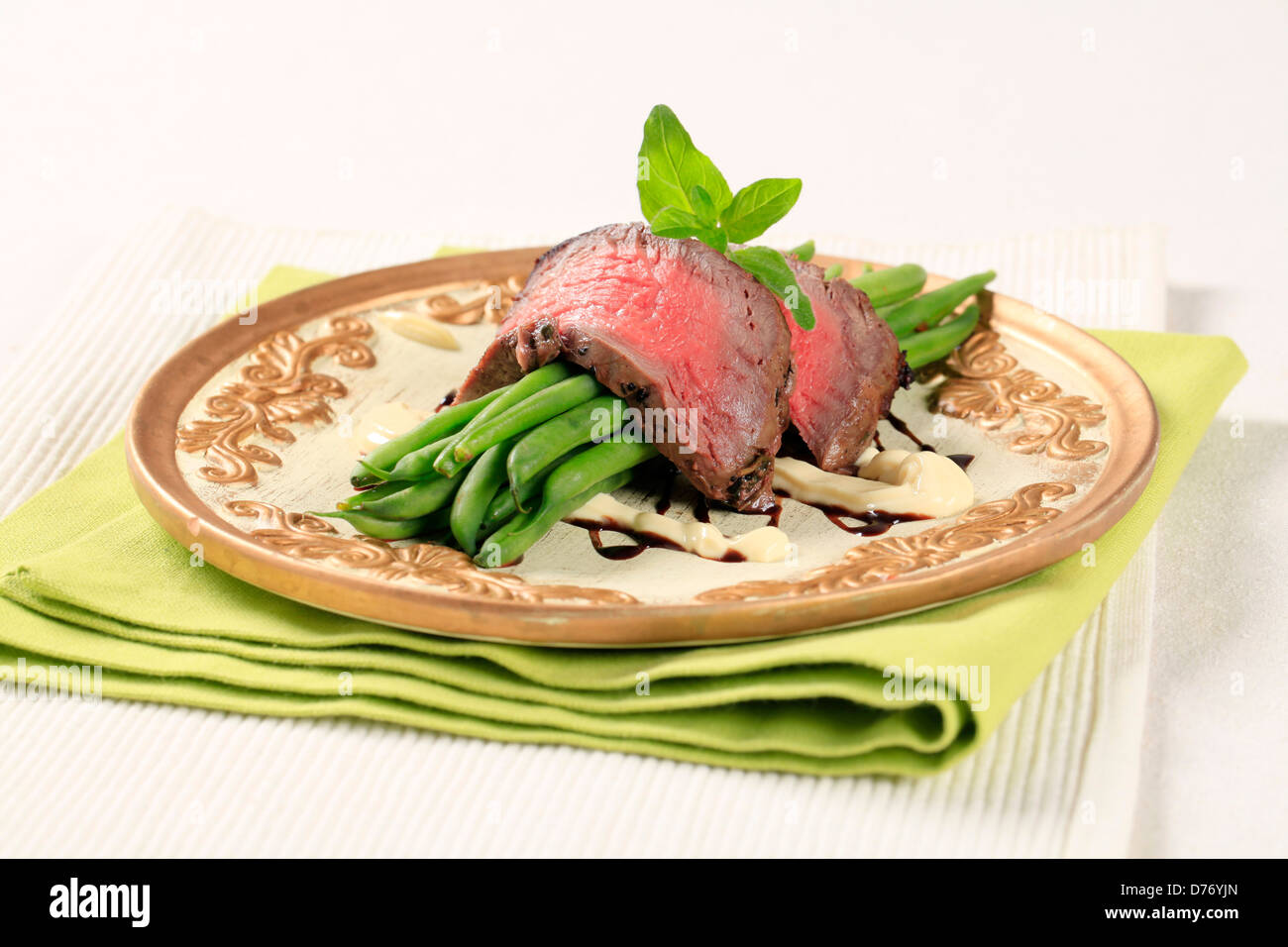Slices of roast beef and string beans Stock Photo - Alamy