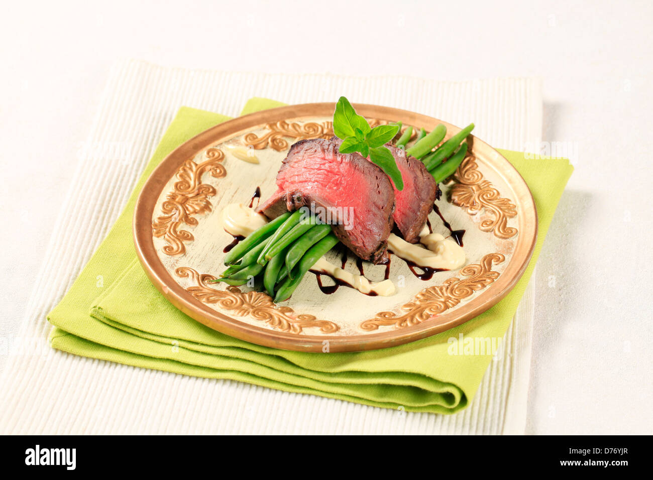 Slices of roast beef and string beans Stock Photo - Alamy