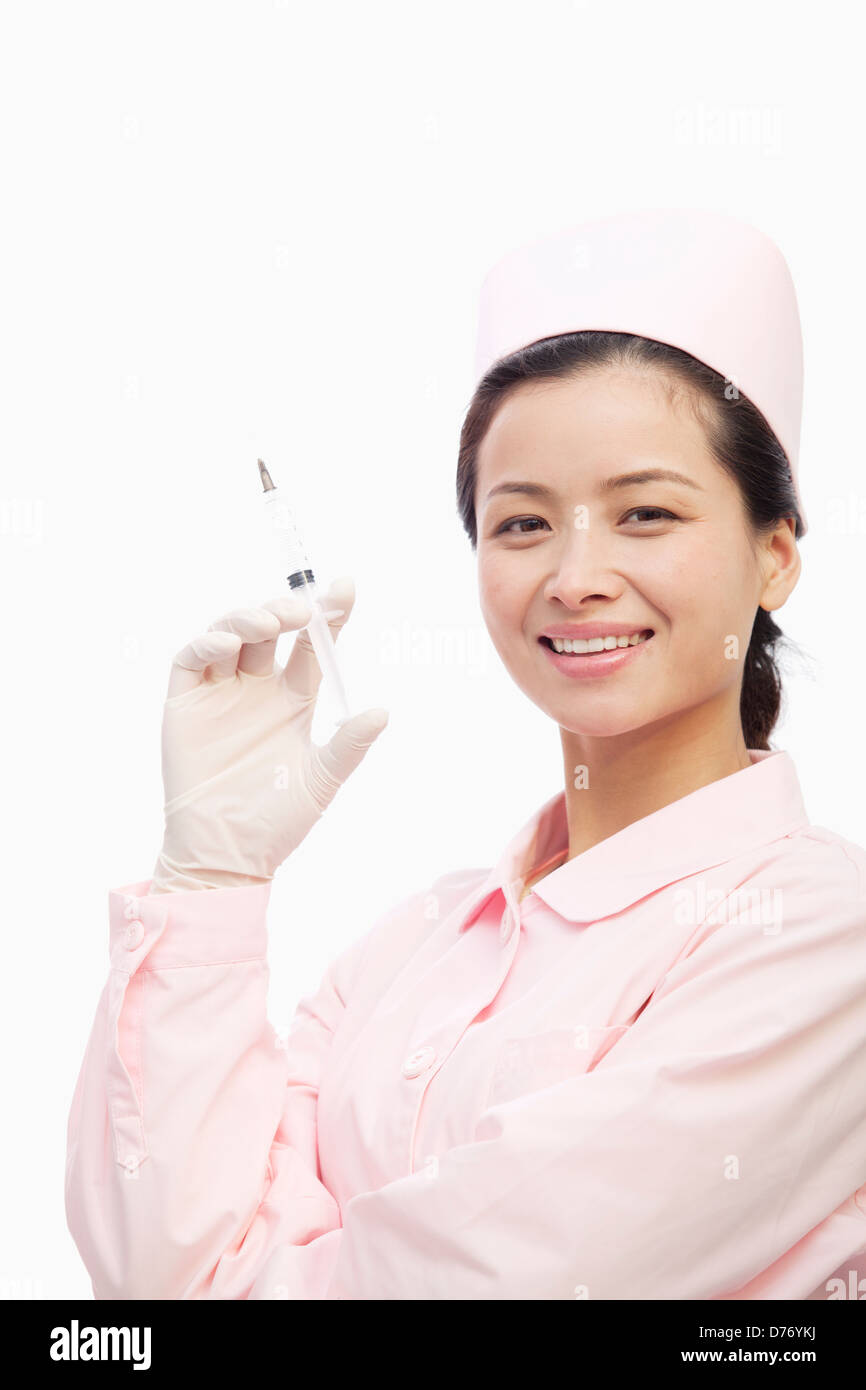 Portrait of Nurse Holding A Syringe, Studio Shot Stock Photo - Alamy