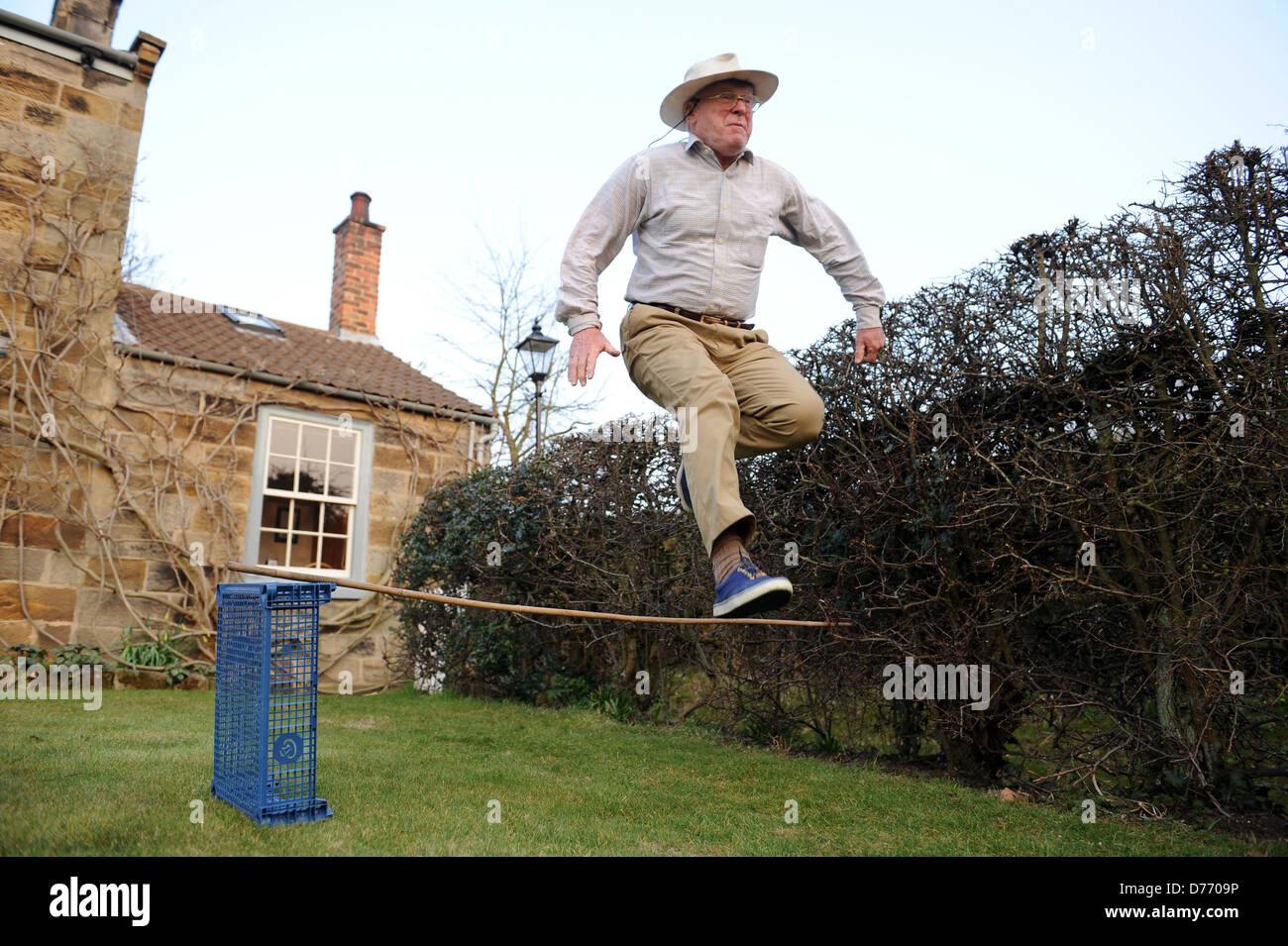 74 year old grandfather jumping around an obstacle course in the family ...