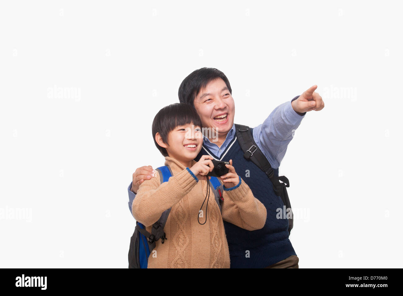 Father pointing with son holding digital camera Stock Photo - Alamy