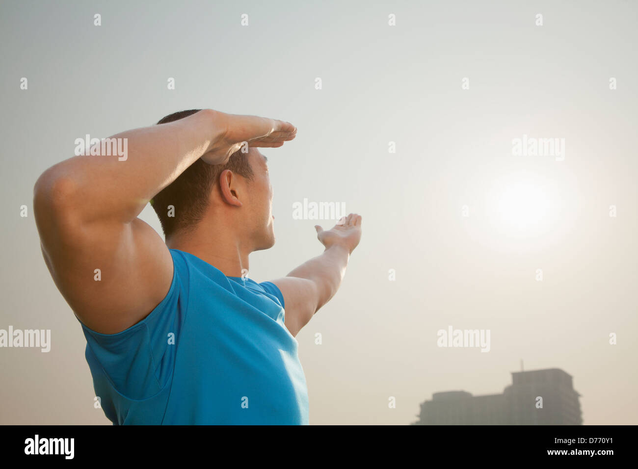 Young Muscular Man Stretching Stock Photo - Alamy