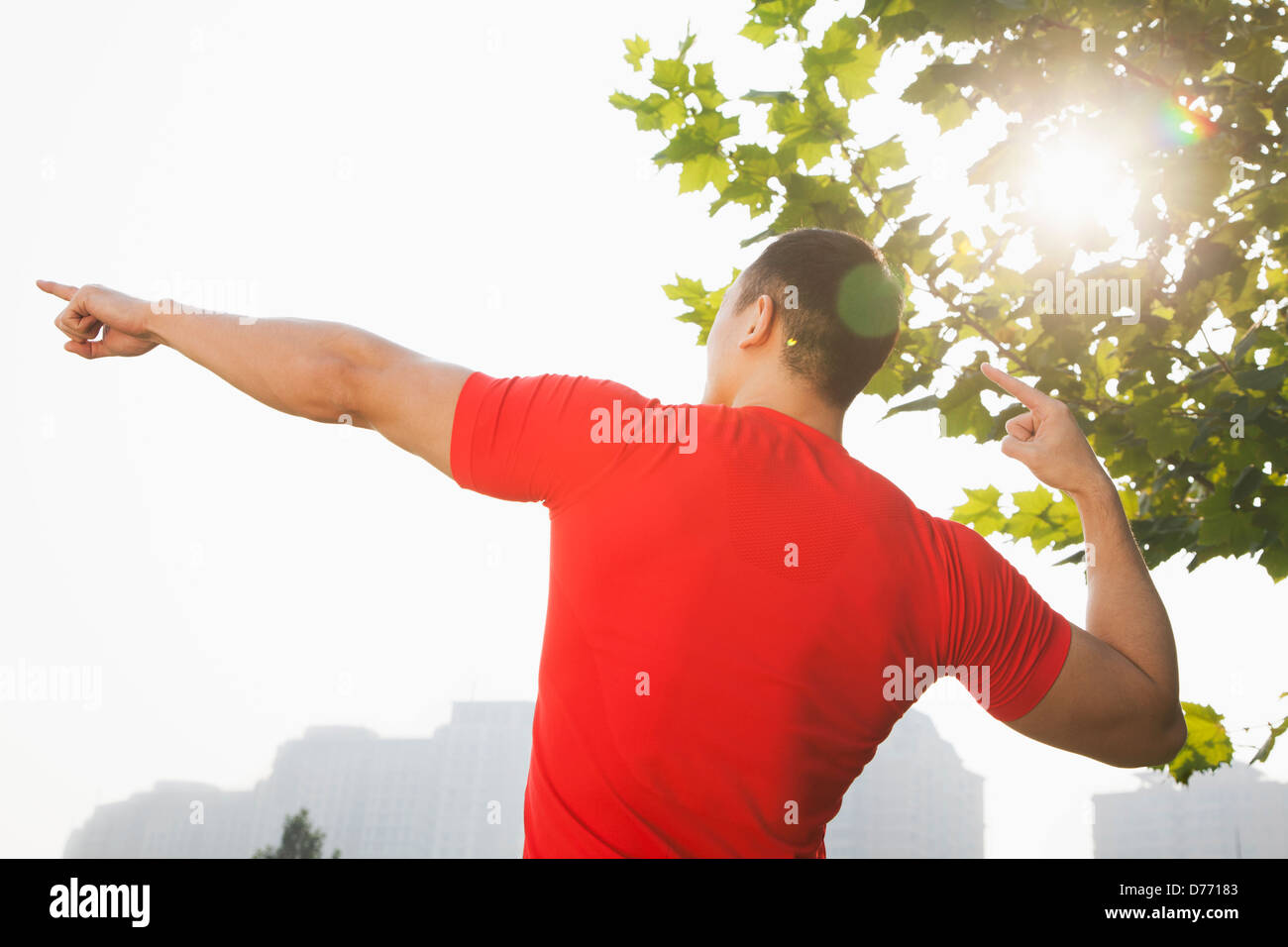 Young Muscular Man Stretching Stock Photo - Alamy