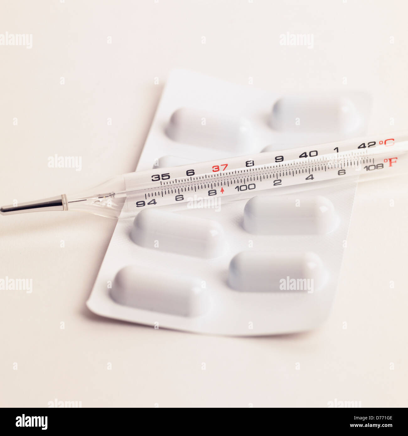 Medical thermometer cold cure capsules Stock Photo - Alamy