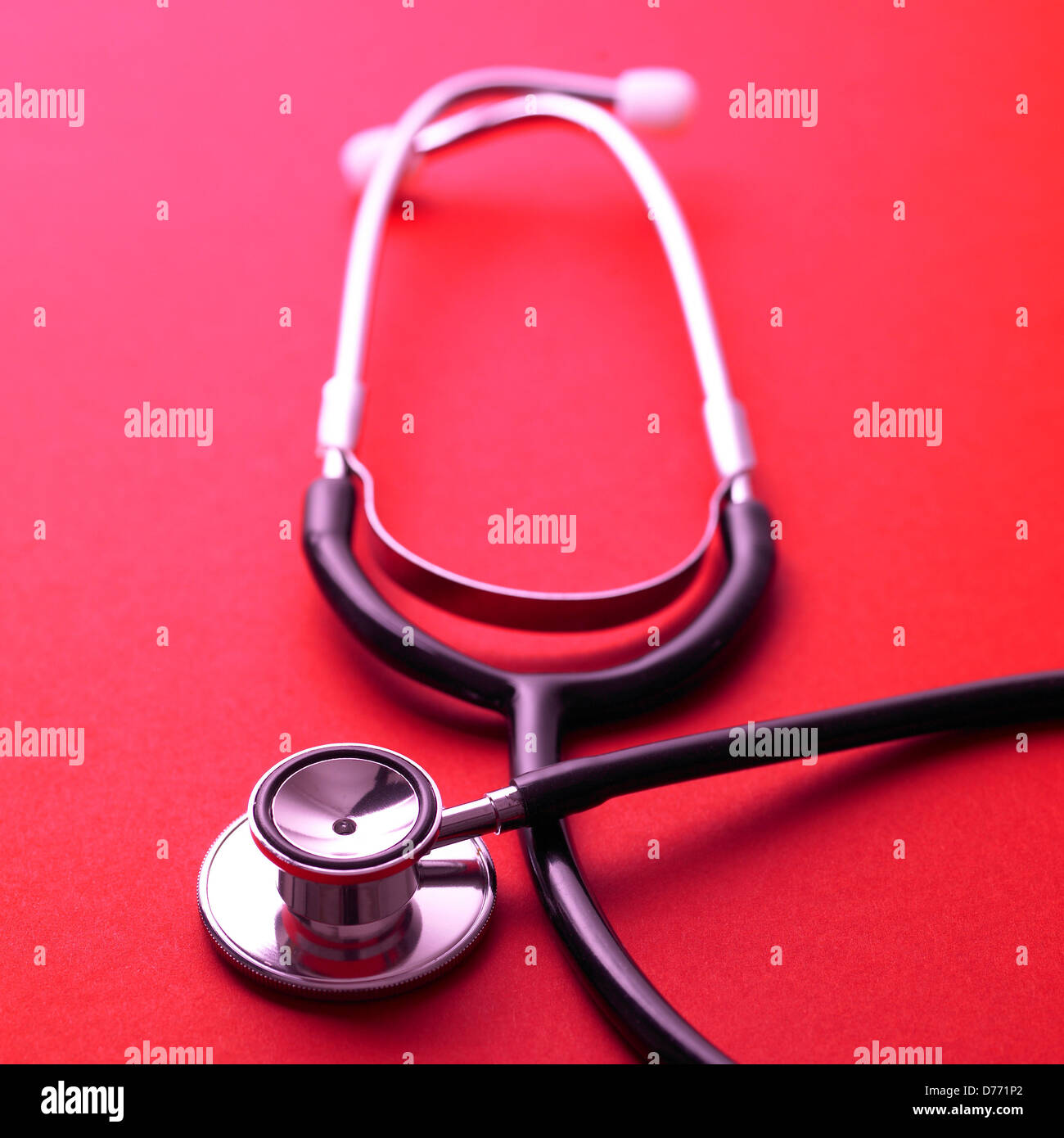 Stethoscope on red background Stock Photo - Alamy
