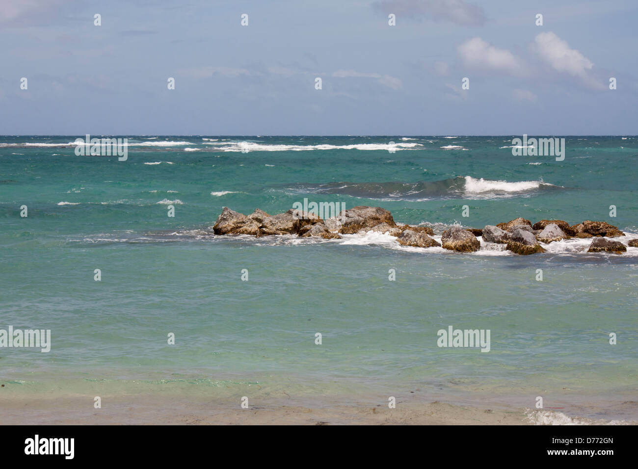 danger sea with stones Stock Photo - Alamy