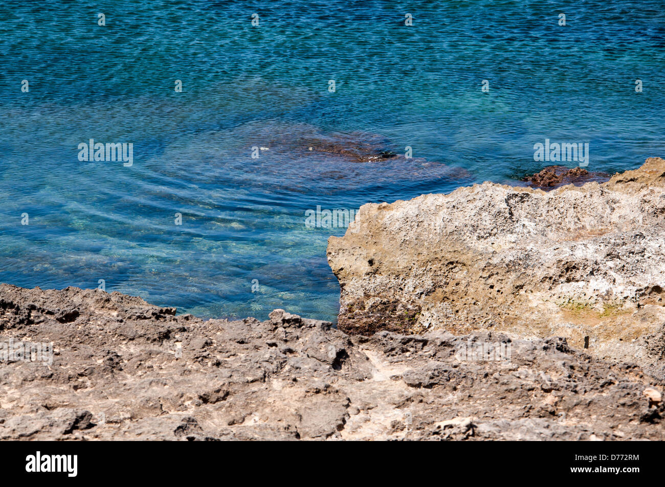 Detail of rugged coastline with clear azure blue waters near Palma de ...