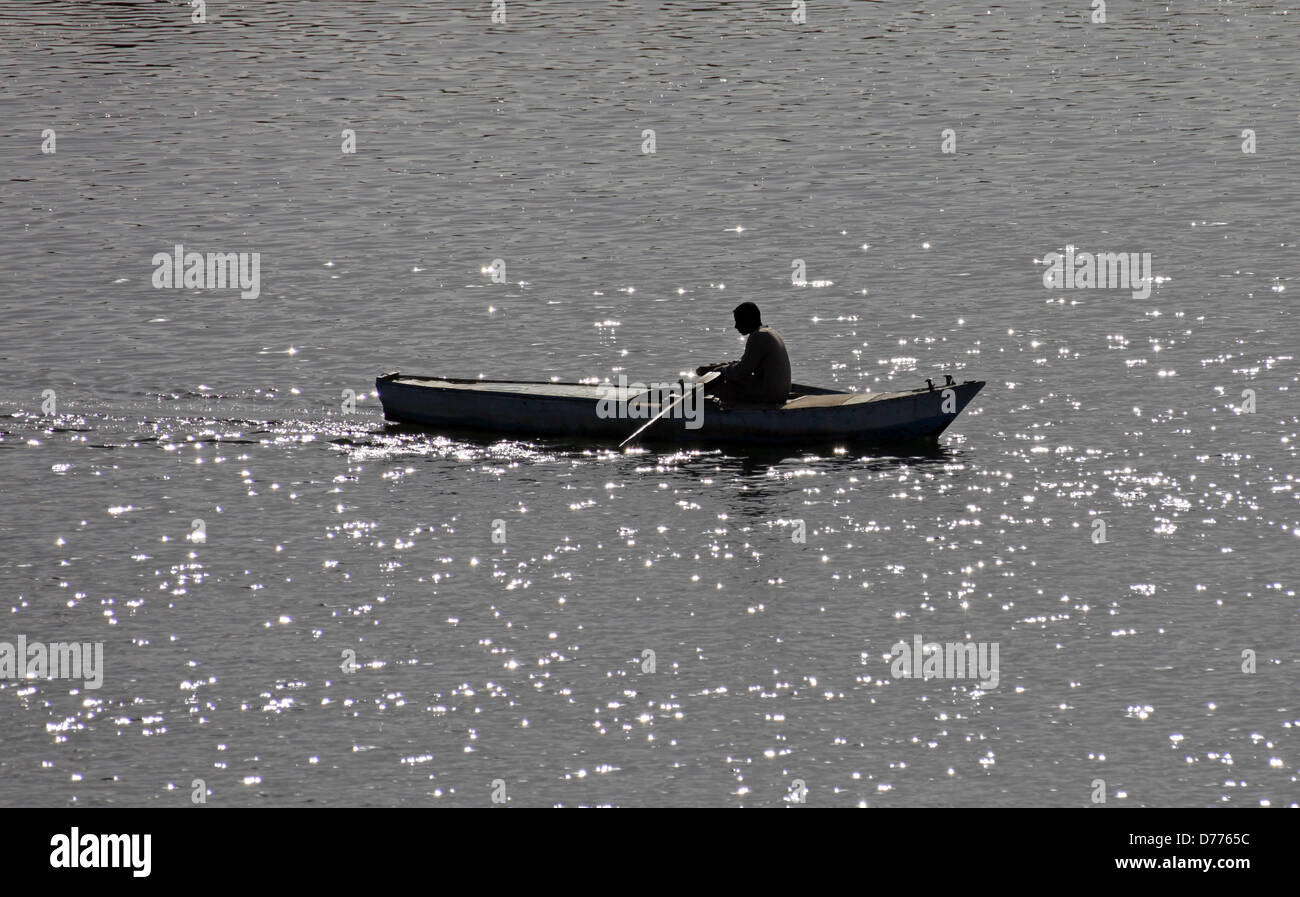 Man in rowing boat hi-res stock photography and images - Alamy