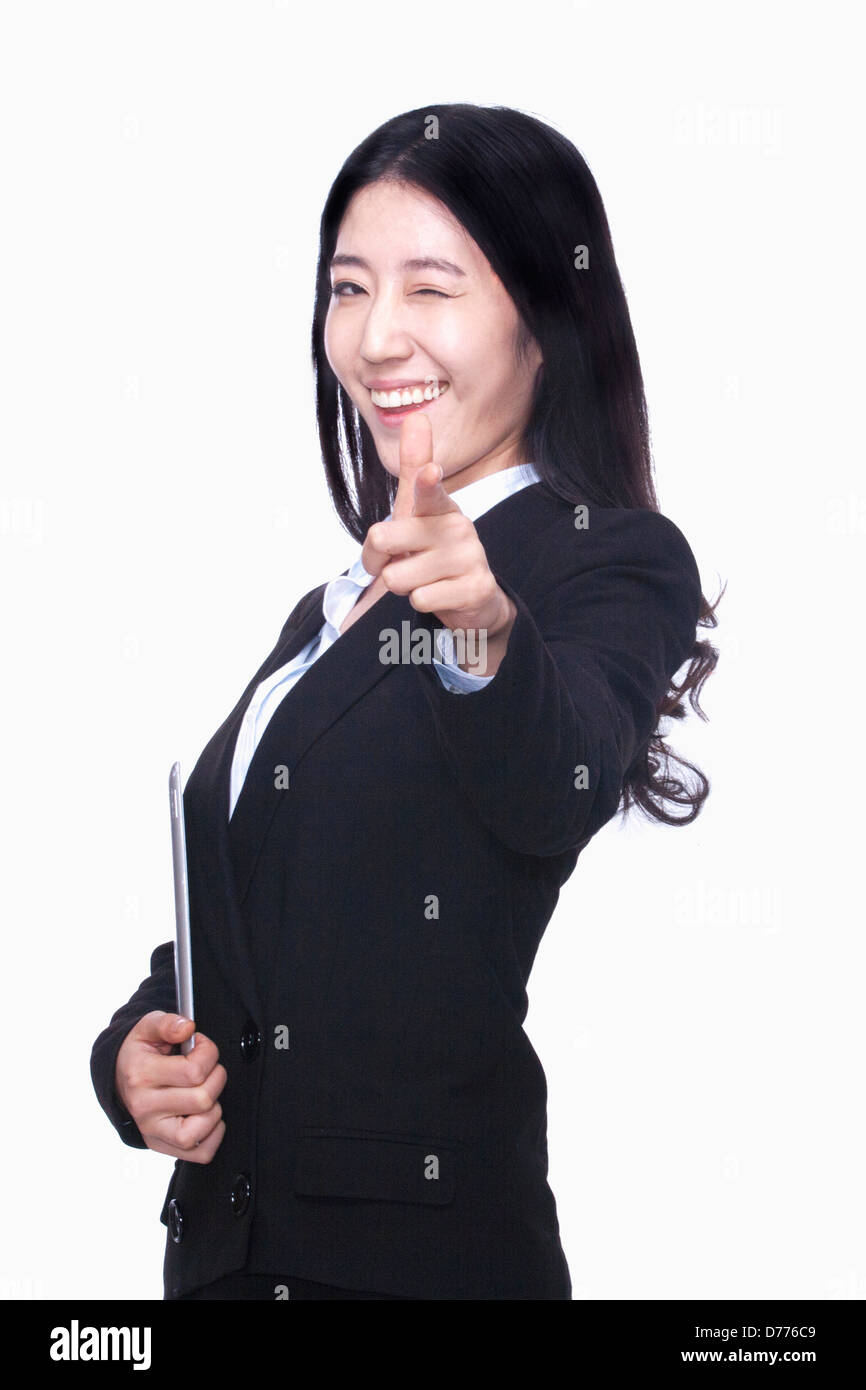 Businesswoman pointing finger like gun Stock Photo - Alamy