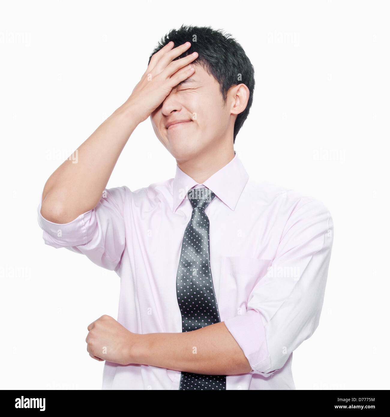 Young man with hand on forehead Stock Photo - Alamy