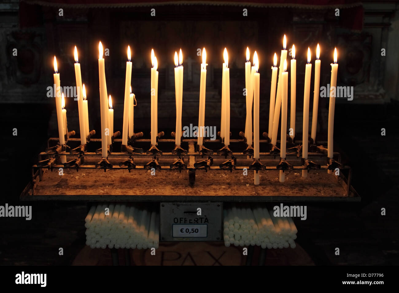 Burning candles in a church Stock Photo - Alamy