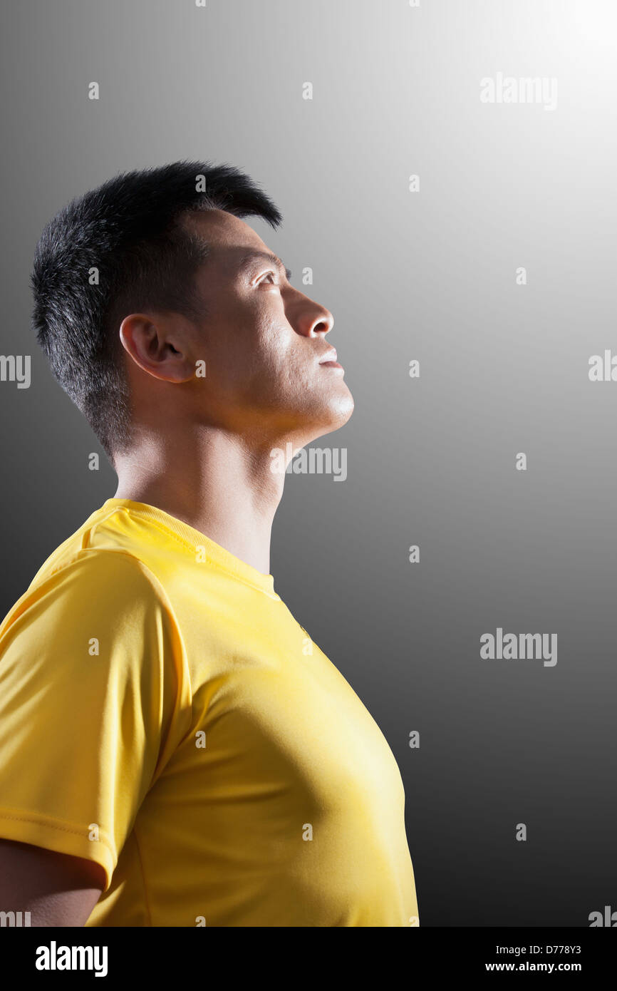 Portrait of athlete, side view Stock Photo - Alamy