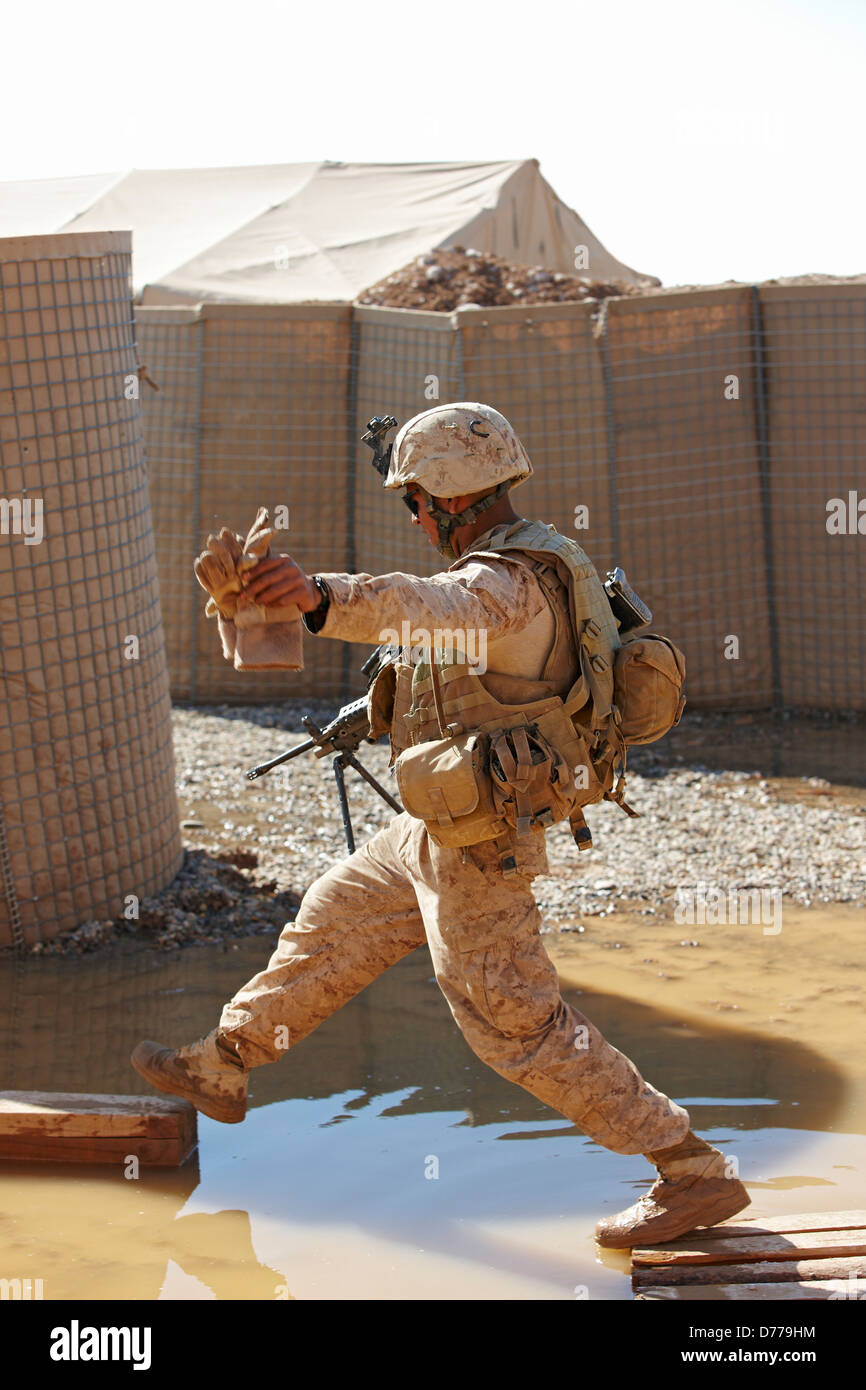 U.S. Marine Jumping Puddle at Remote Austere U.S. Marine Corps Combat ...