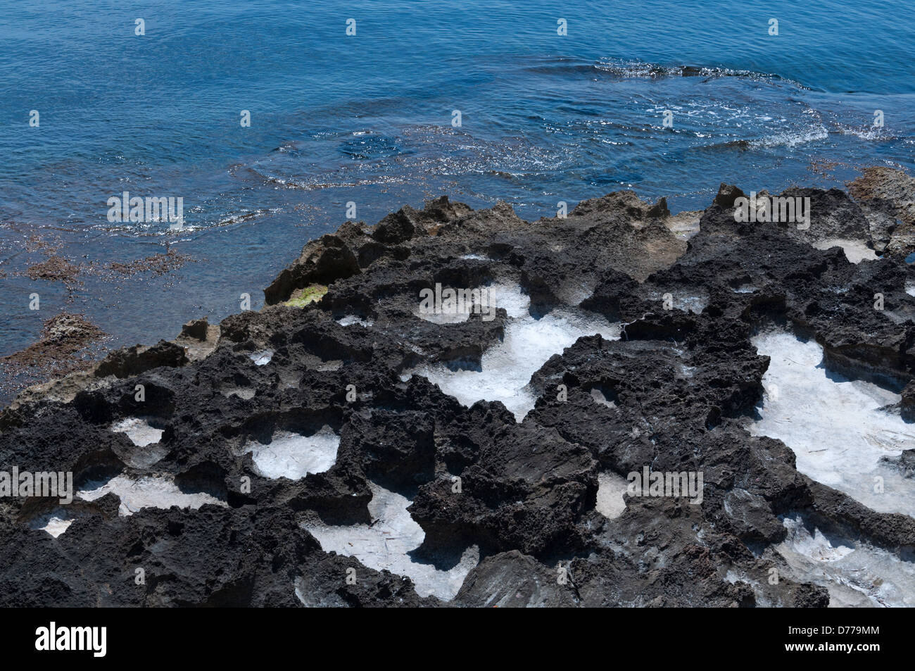 Pits of sea salt in rocky environment by the seaside, Majorca ...