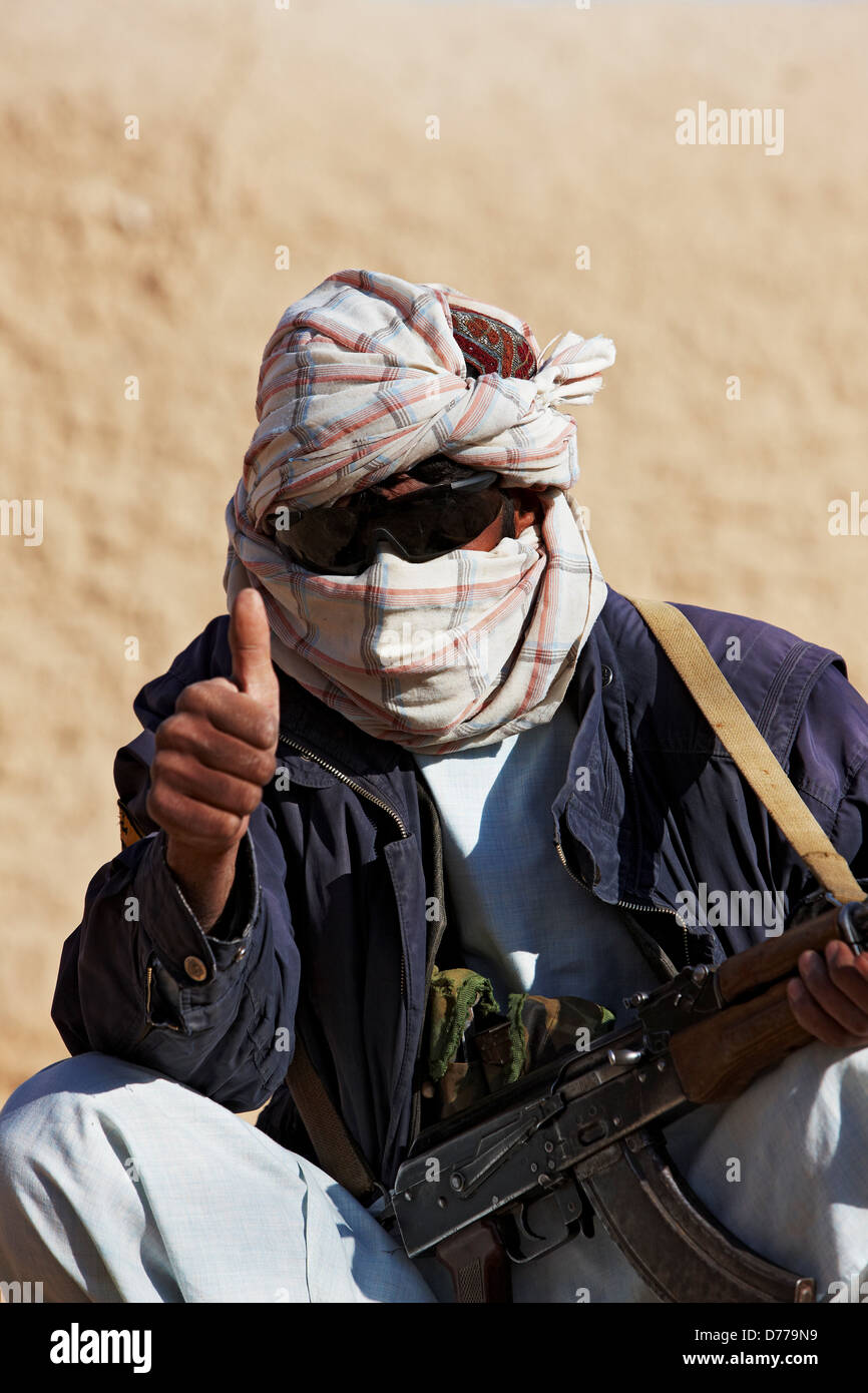 A Fighter Cloaked in Headdress Sunglasses Gives 'Thumbs Up' During ...