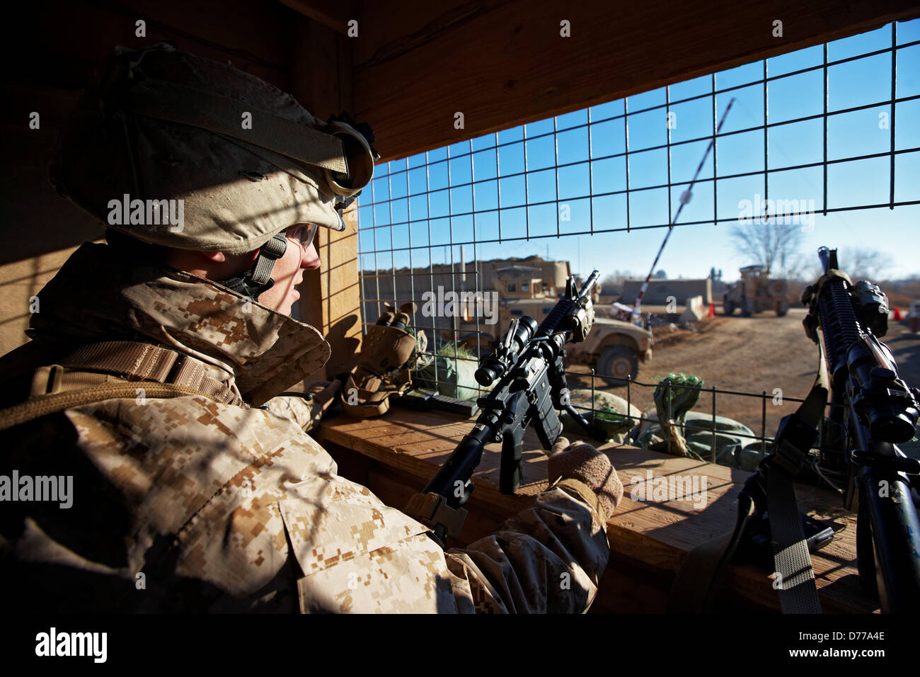A U.S. Marine Standing Watch in Guard Tower at Forward Operating Base ...