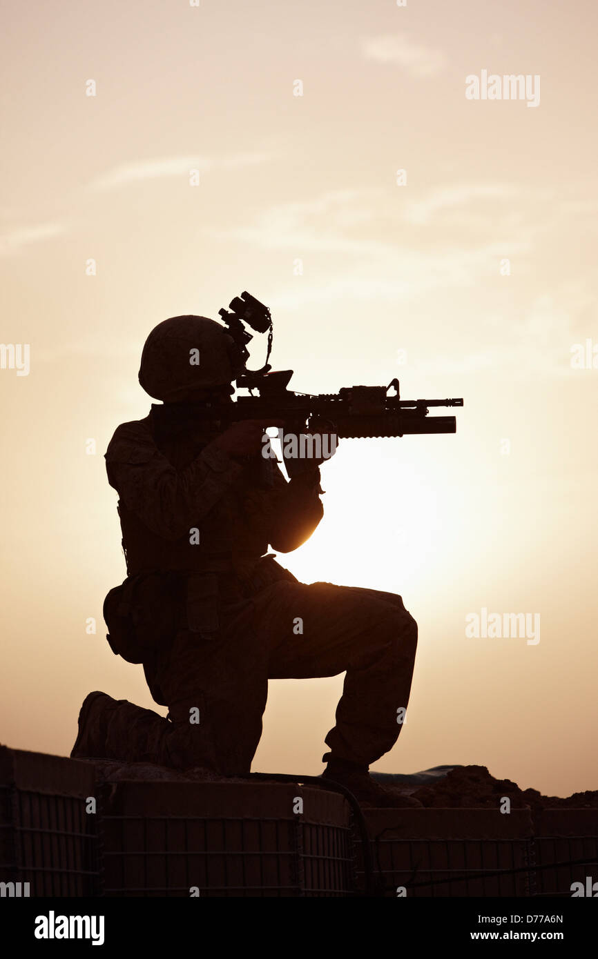 Silhouette U.S. Marine Aiming M4 Carbine During Combat Operation in ...