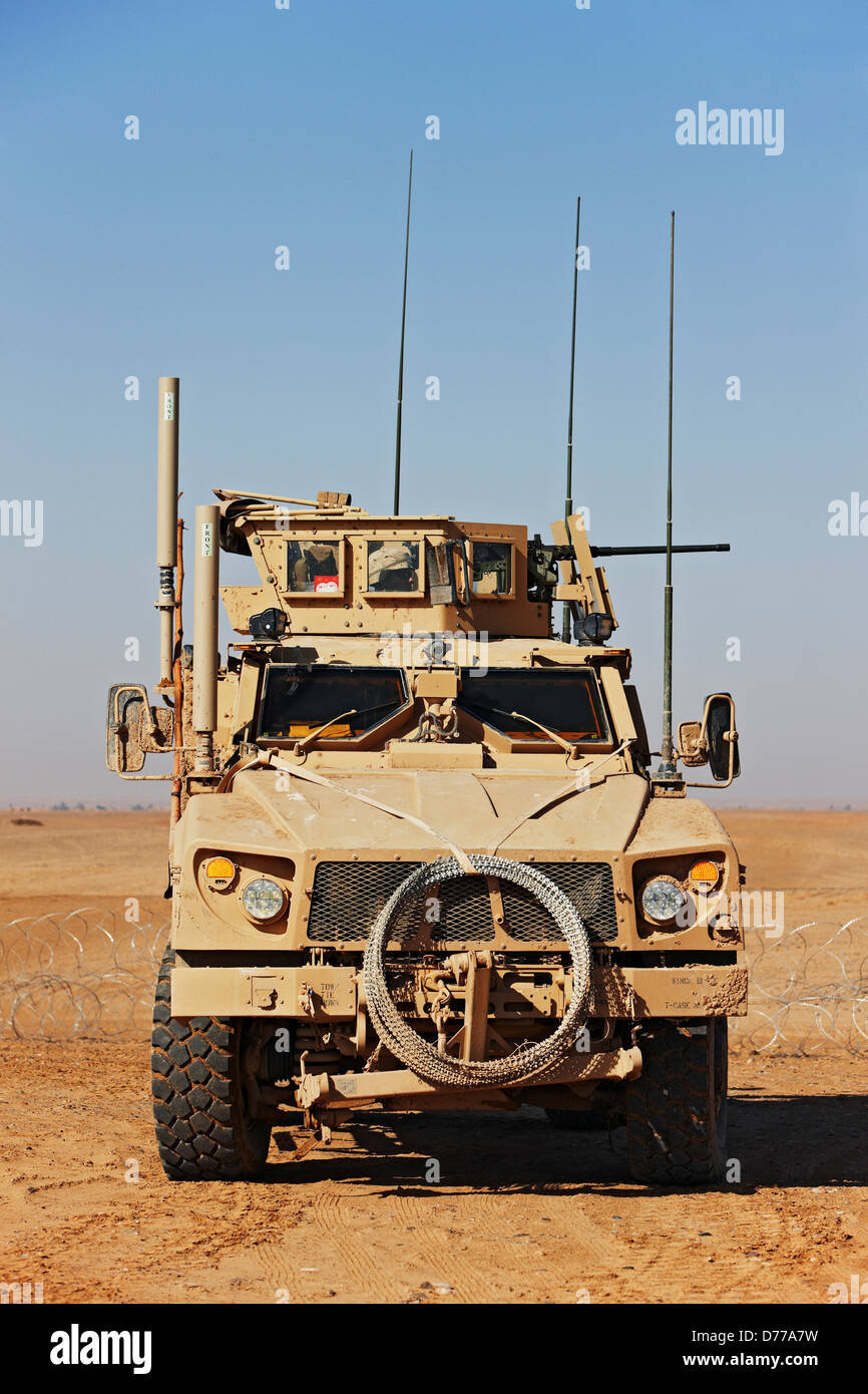 A U.S. Marine M-ATV or Mine Resistant Ambush Protected All Terrain Vehicle in Open Desert in ...