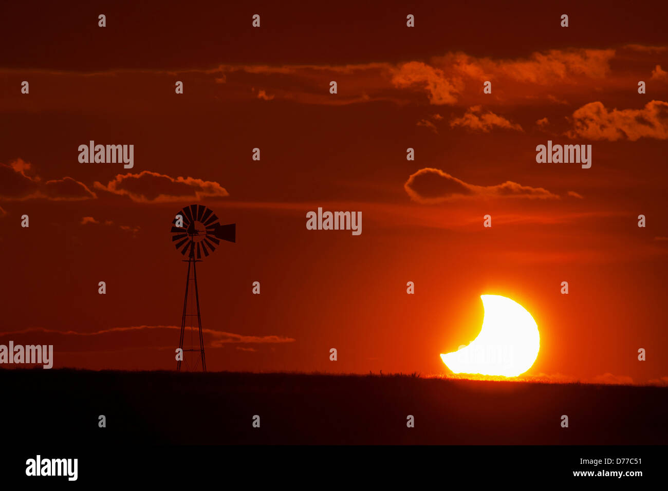 Windmill Silhouetted by Solar Eclipse Stock Photo - Alamy